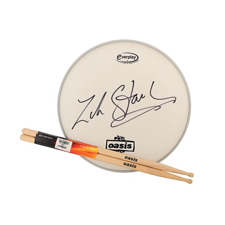 558. Zak Starkey-Autographed Drumskin and Sticks ### OASIS