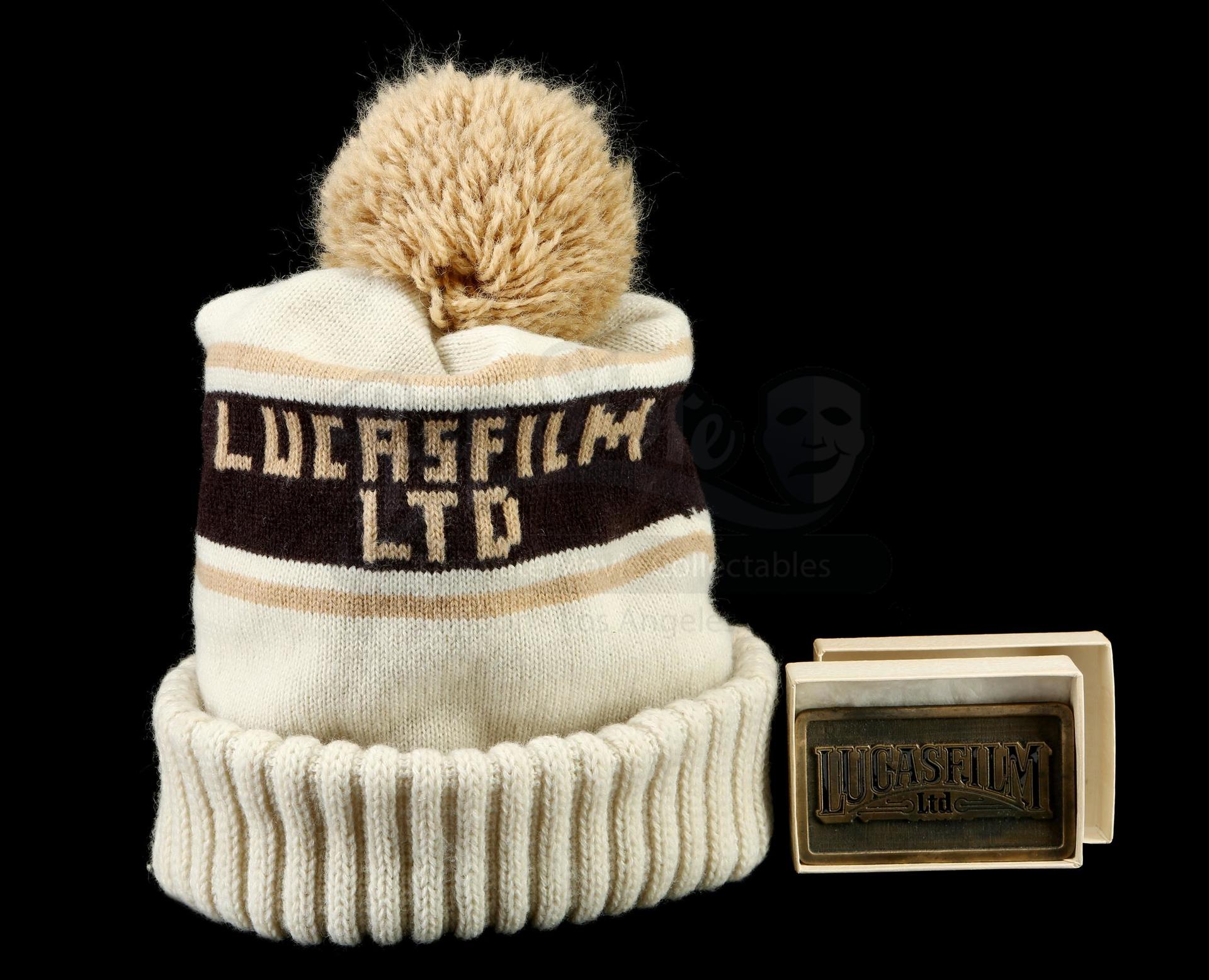 Lot # 389: Lucasfilm Ltd. Knit Beanie and Metal Paperweight